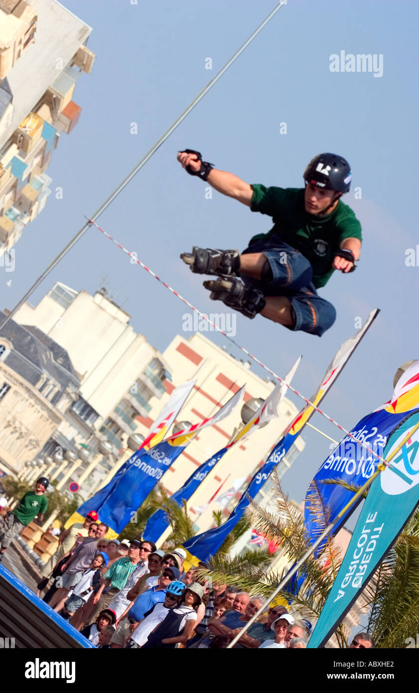 Roller skater jumping a ramp Stock Photo - Alamy