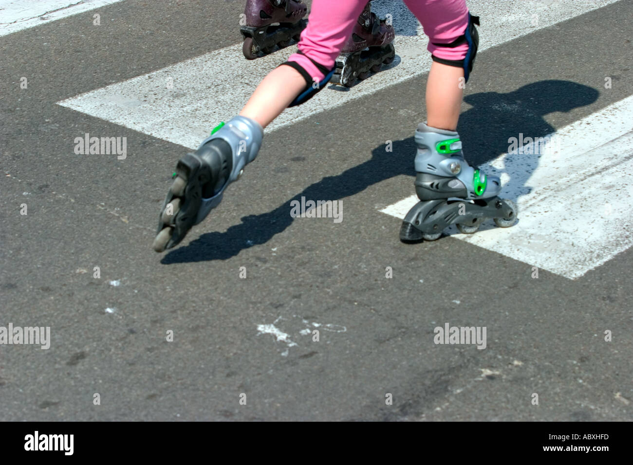 kids children roller blading on the street with protection of body ...