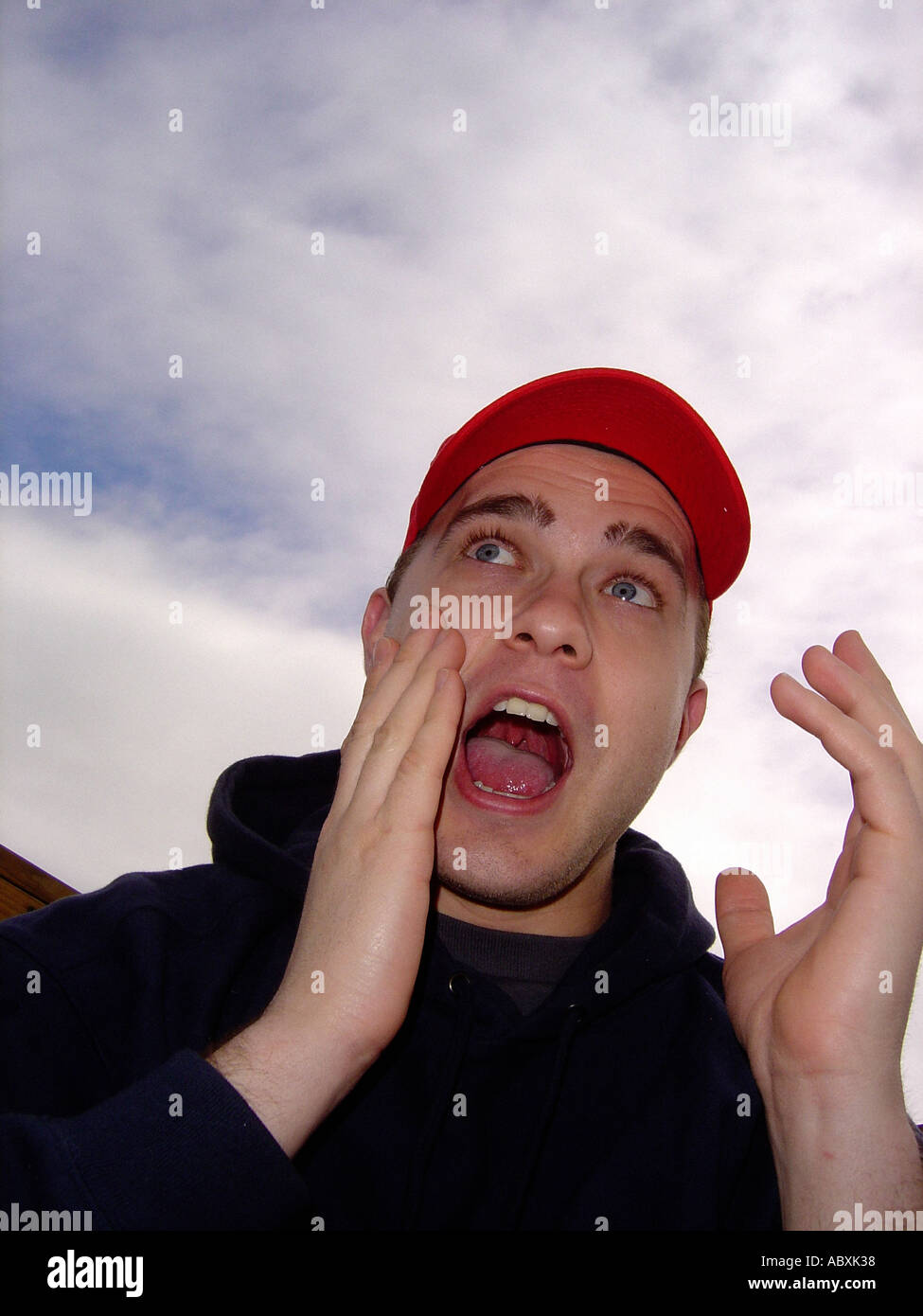 Outdoor Scene of Sports Fan Fanatic Wearing A Red Sports Cap Stock ...