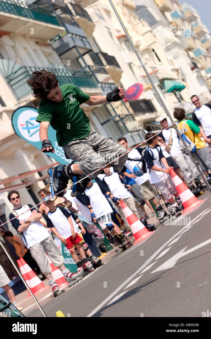Roller skater jumping a ramp Stock Photo - Alamy
