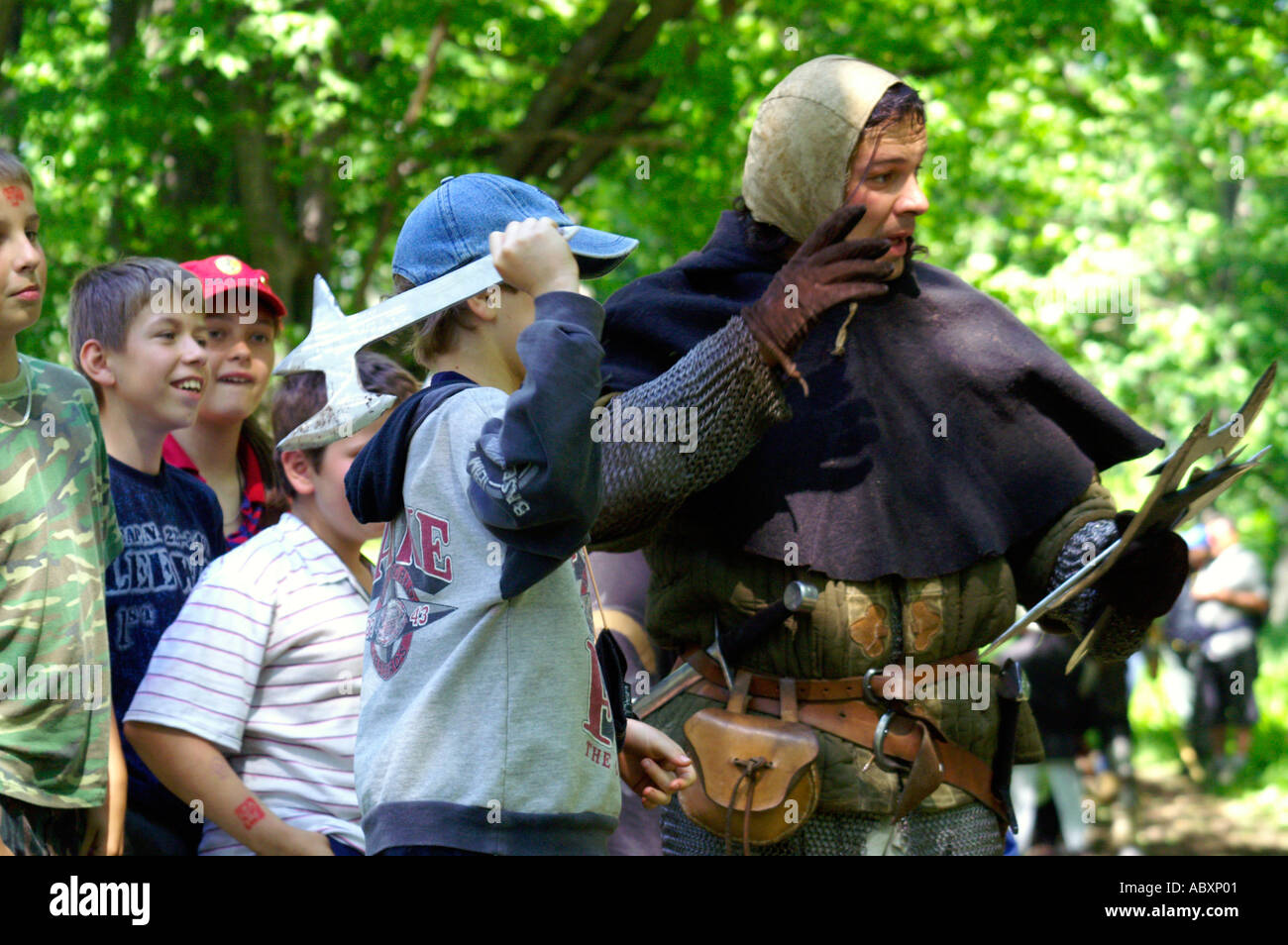 Children Throwing an Axe at Muran Castle historic festival, Slovakia ...
