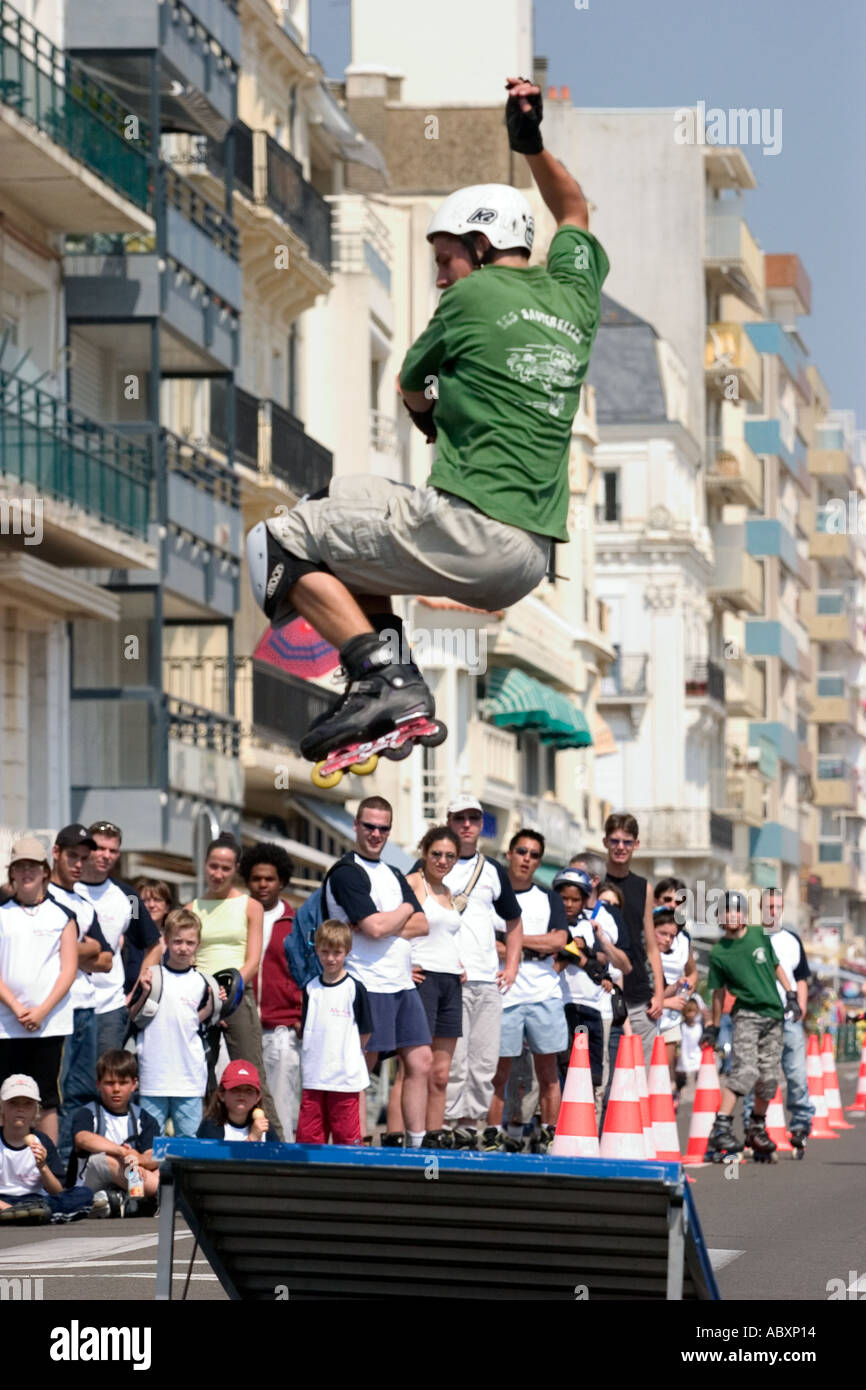 Roller skater jumping a ramp Stock Photo - Alamy