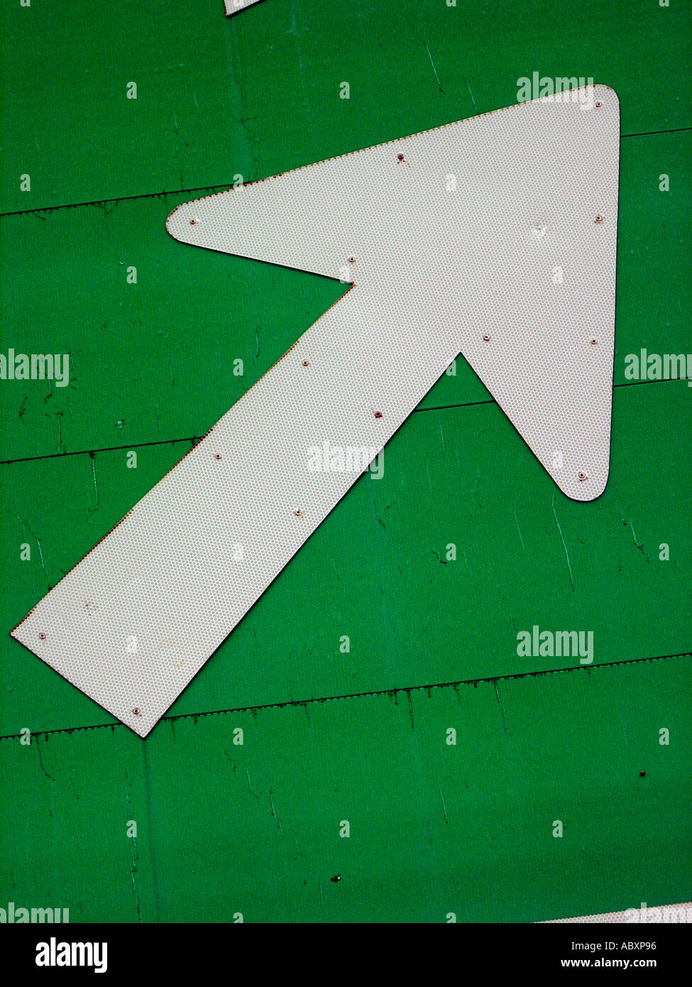 Directional Arrow on Green Road Sign Stock Photo - Alamy