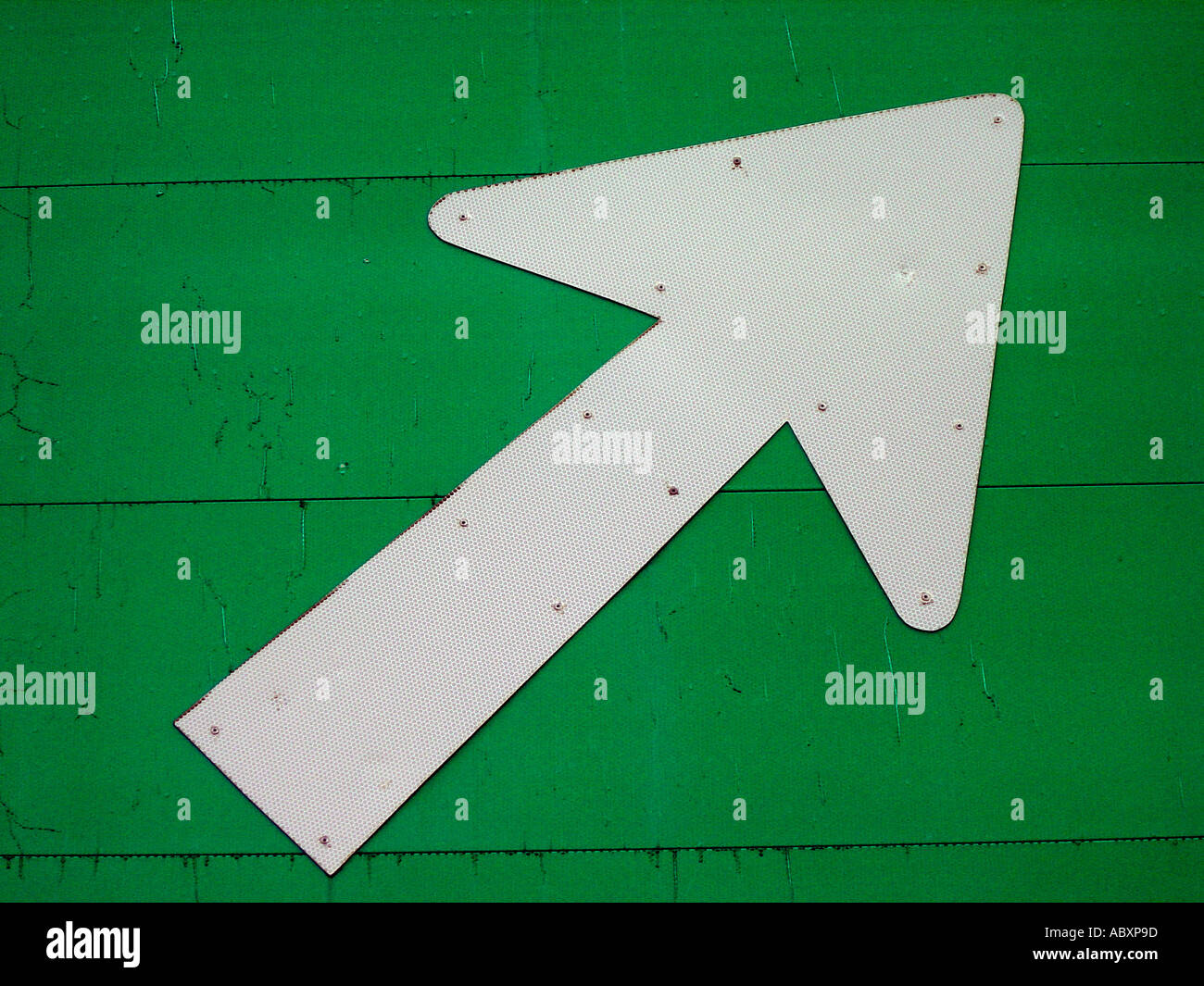 Directional Arrow on Green Road Sign Stock Photo - Alamy