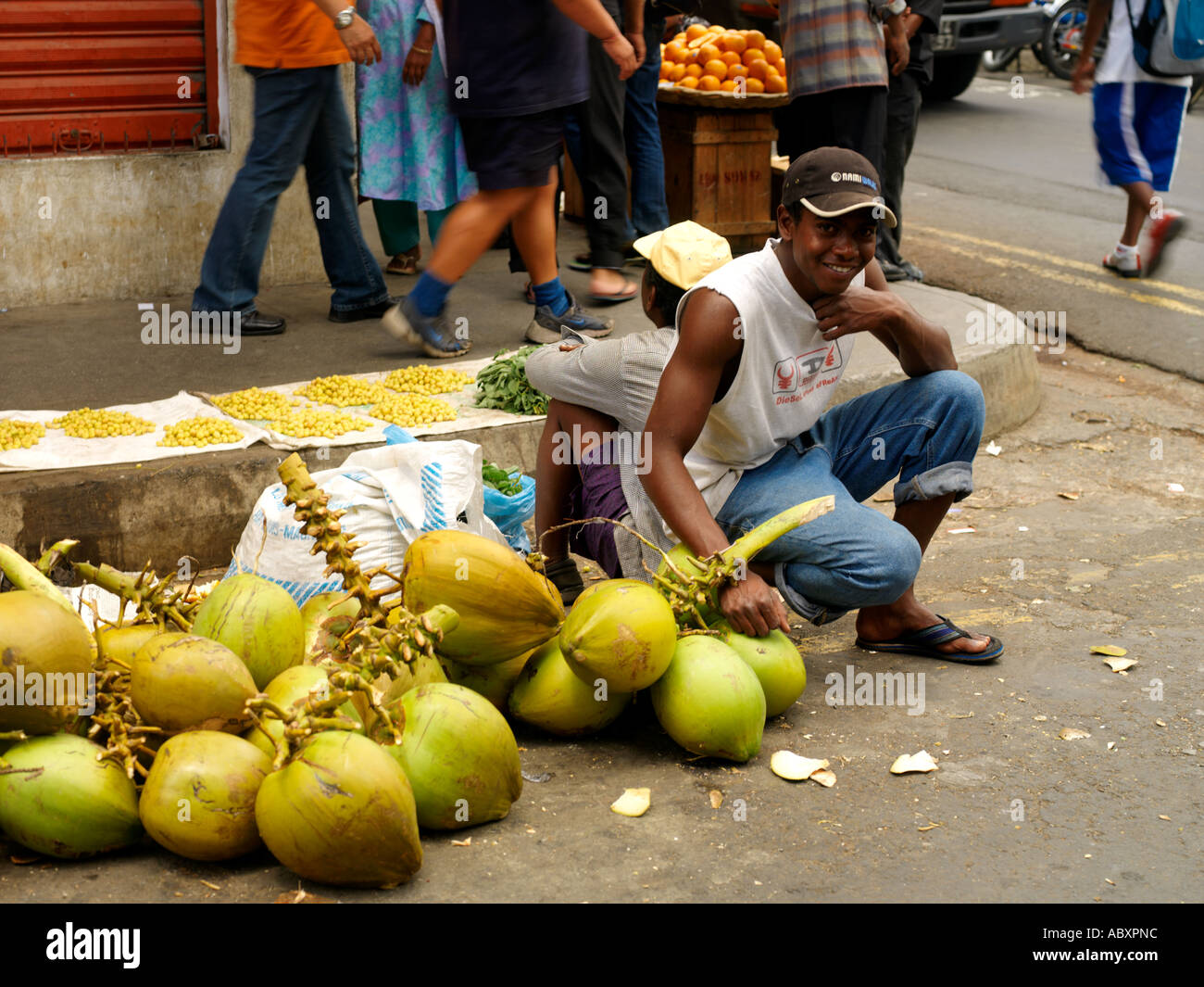 Port Louis Market Mauritius Man Selling Coconuts Stock Photo - Alamy