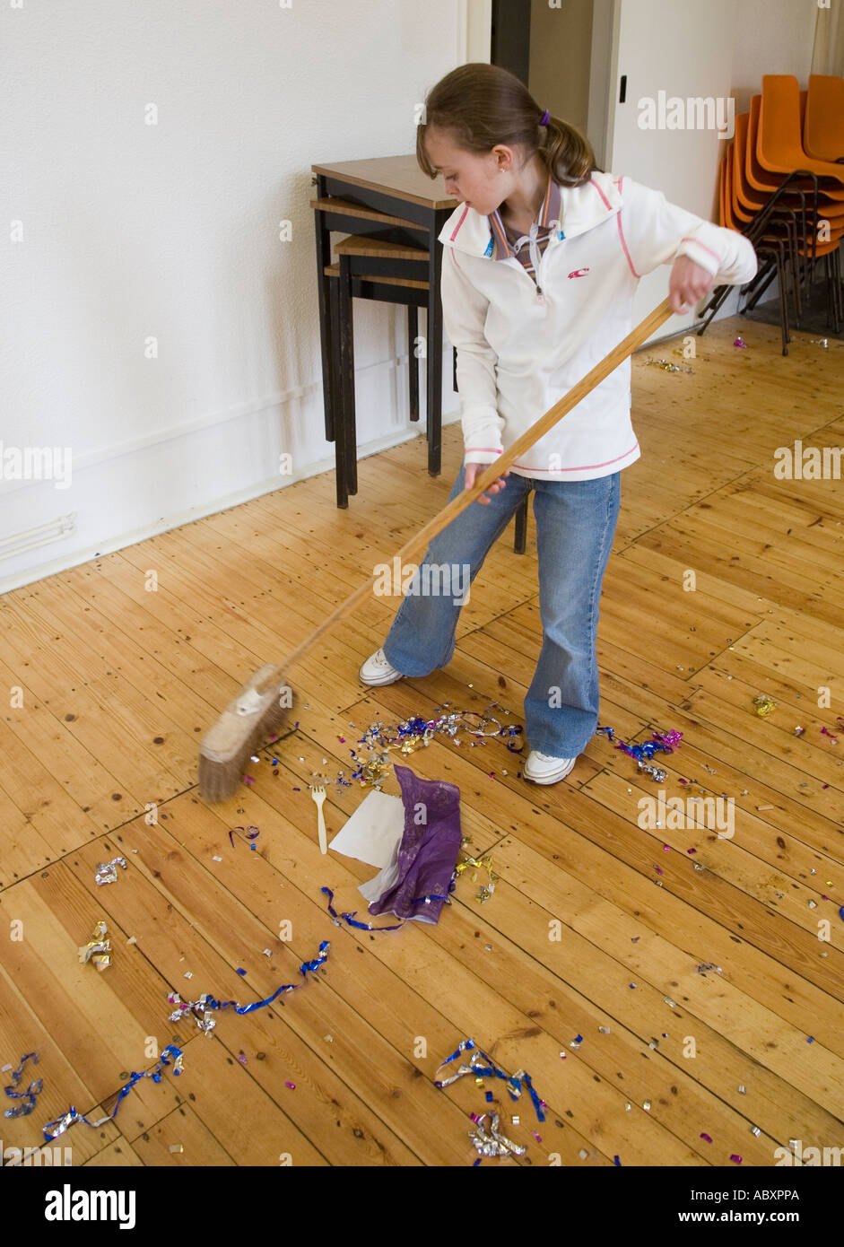 Young girl helping to sweep up the day after a wedding party Wales UK ...