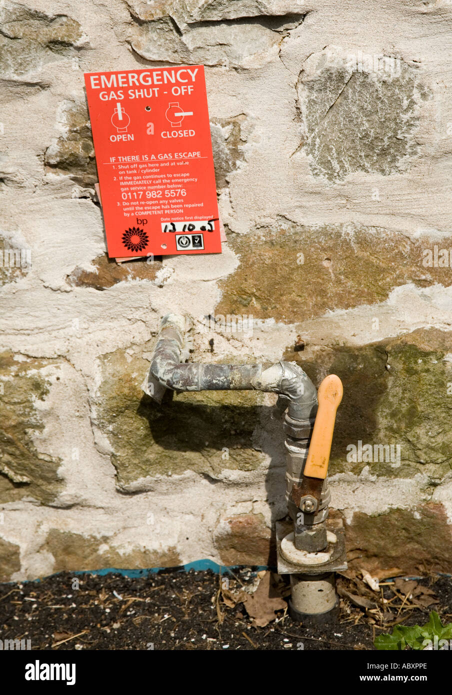 Emergency gas shutoff control and safety sign outside a building Wales ...
