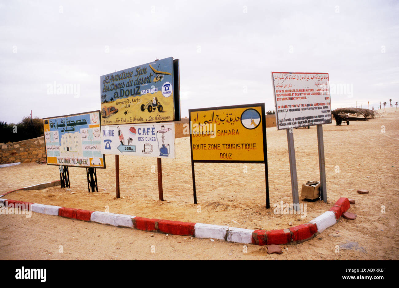 Arabic and English bilingual signs at edge of Sahara desert Douz ...