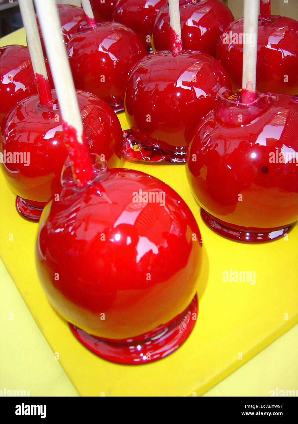 Still Life of Red Candied Apples on a Yellow Tray Stock Photo - Alamy