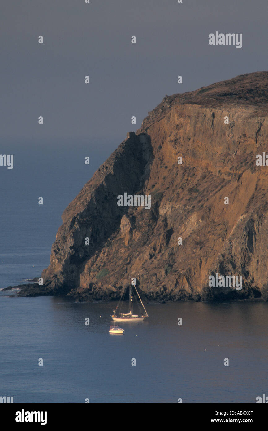 Sailboat anchored below steep coastal cliffs Anacapa Island Channel ...