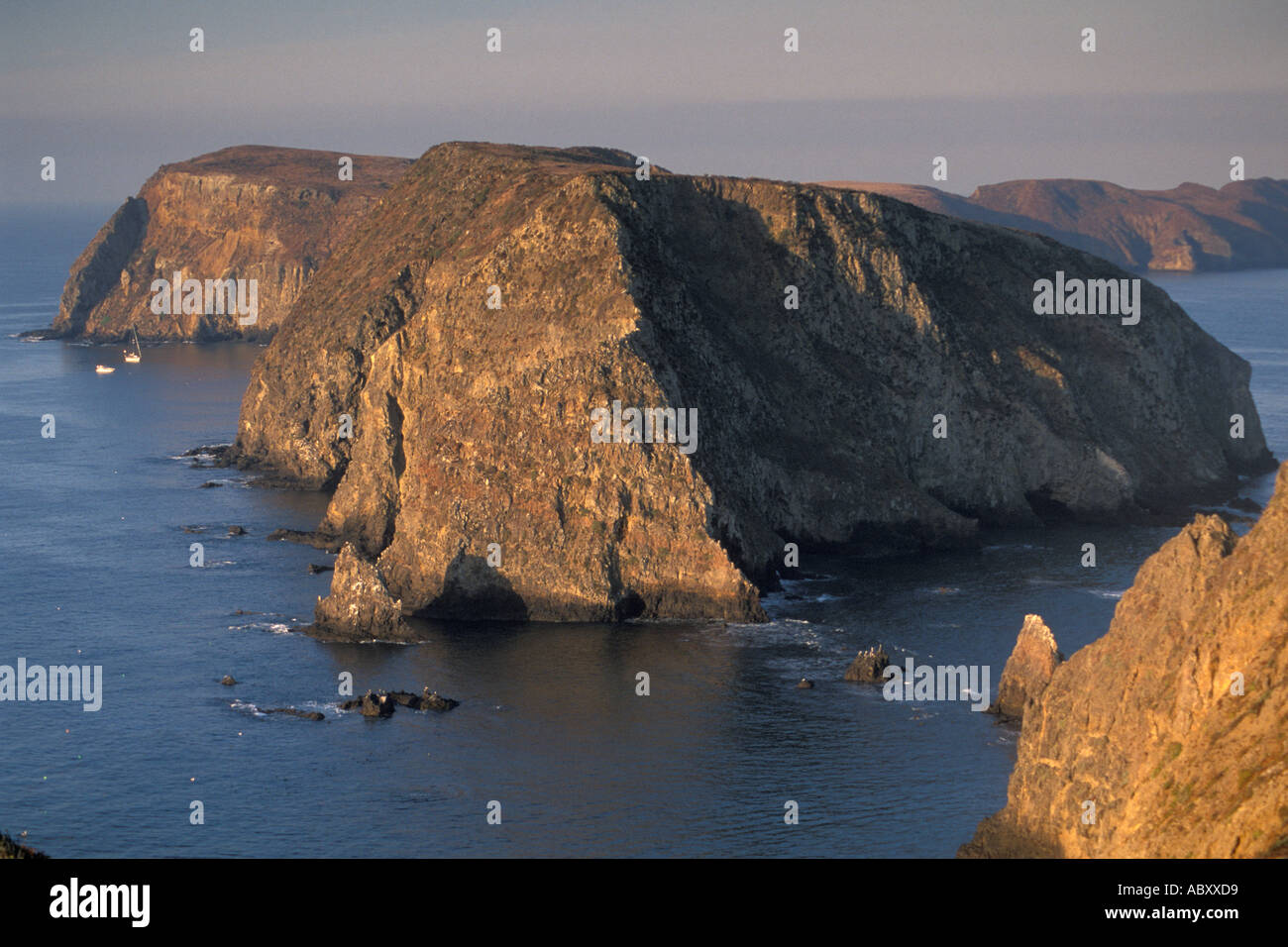 Sailboat anchored below steep coastal cliffs Anacapa Island Channel ...