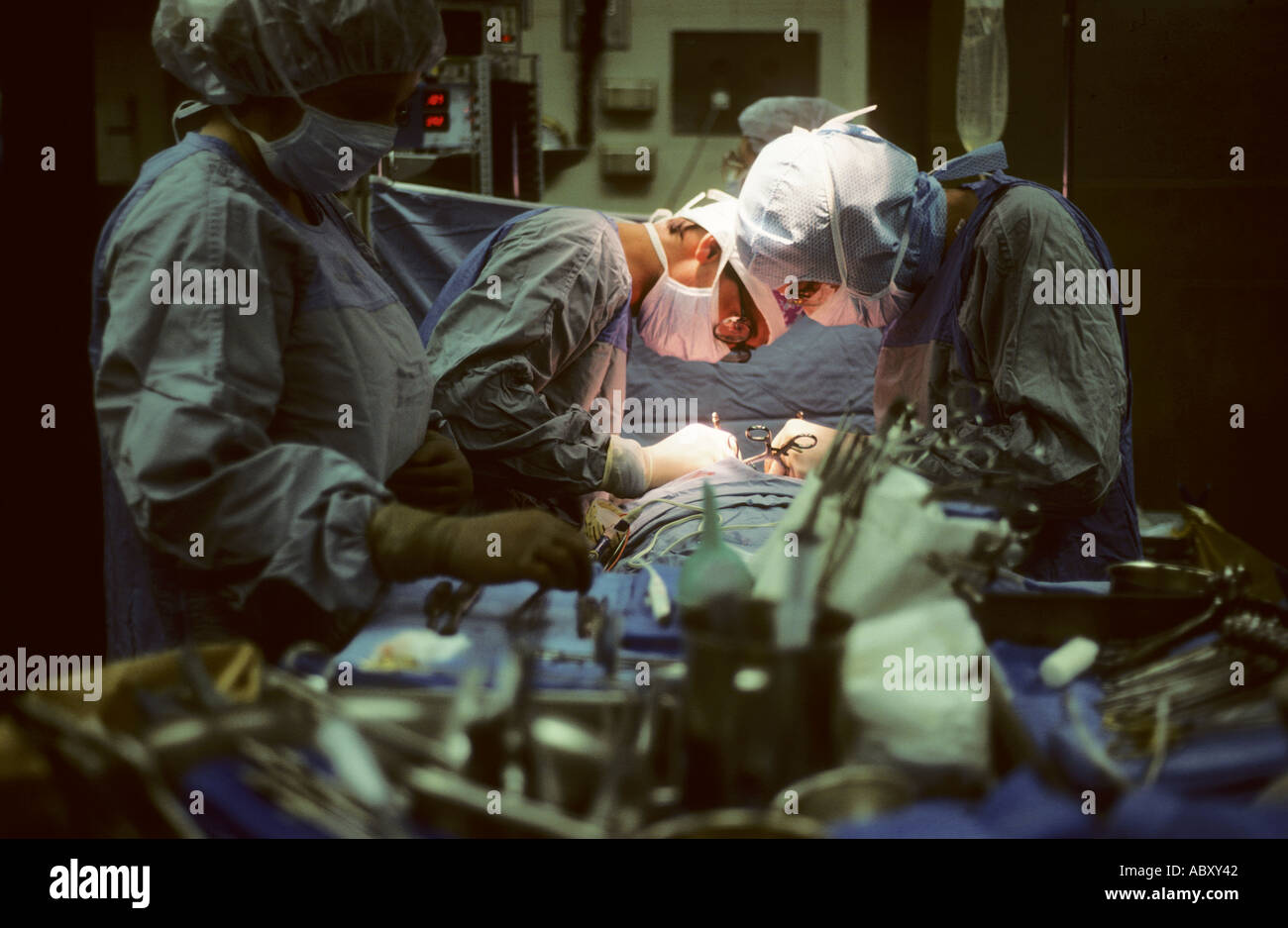 doctors performing surgery in operating room Stock Photo - Alamy