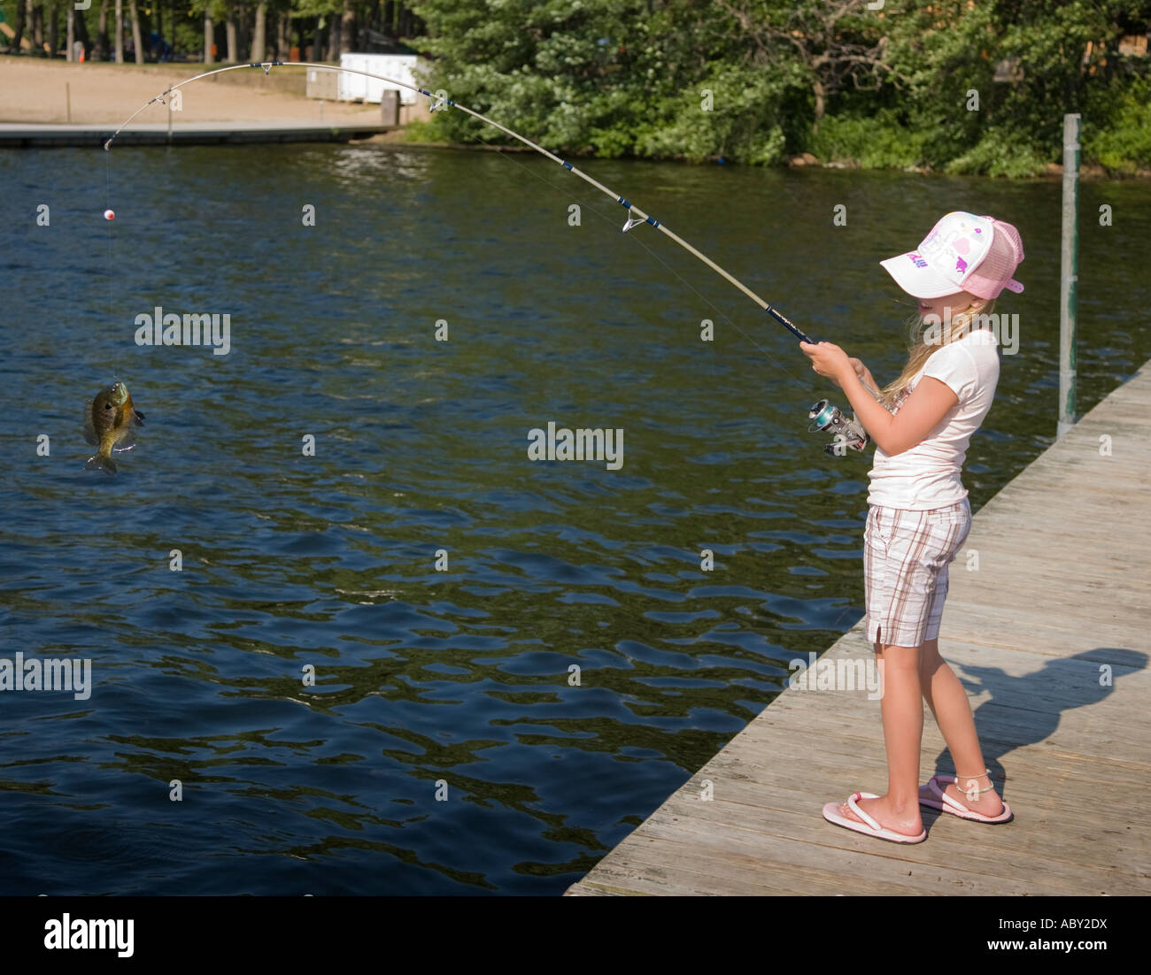 Child catching a fish Stock Photo - Alamy