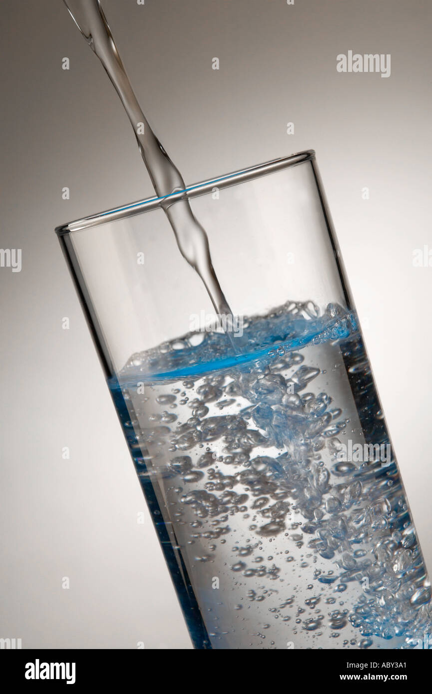 WATER POURING INTO GLASS TUMBLER Stock Photo - Alamy