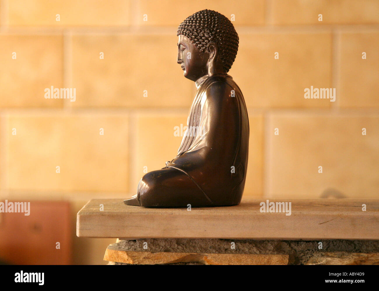 Small Buddha statue in wellness spa Stock Photo - Alamy