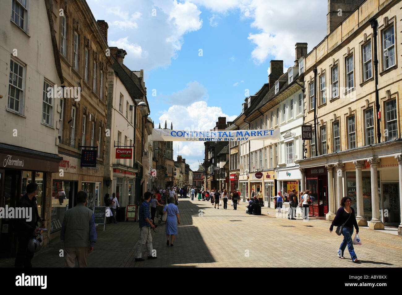 Tourists and local people visit the ancient market town centre of ...