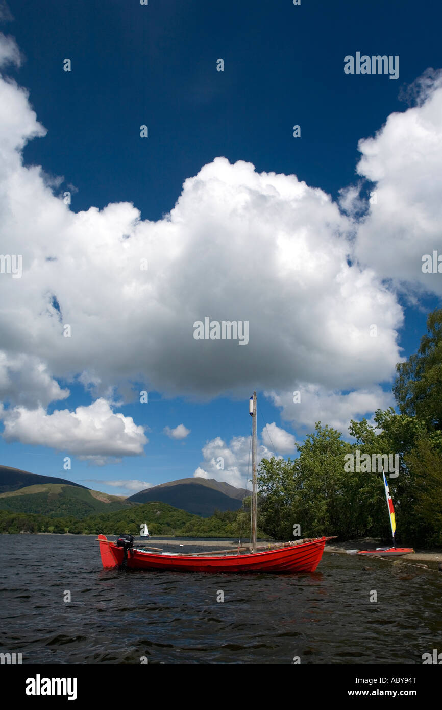 Red Dinghy moored by island Stock Photo - Alamy