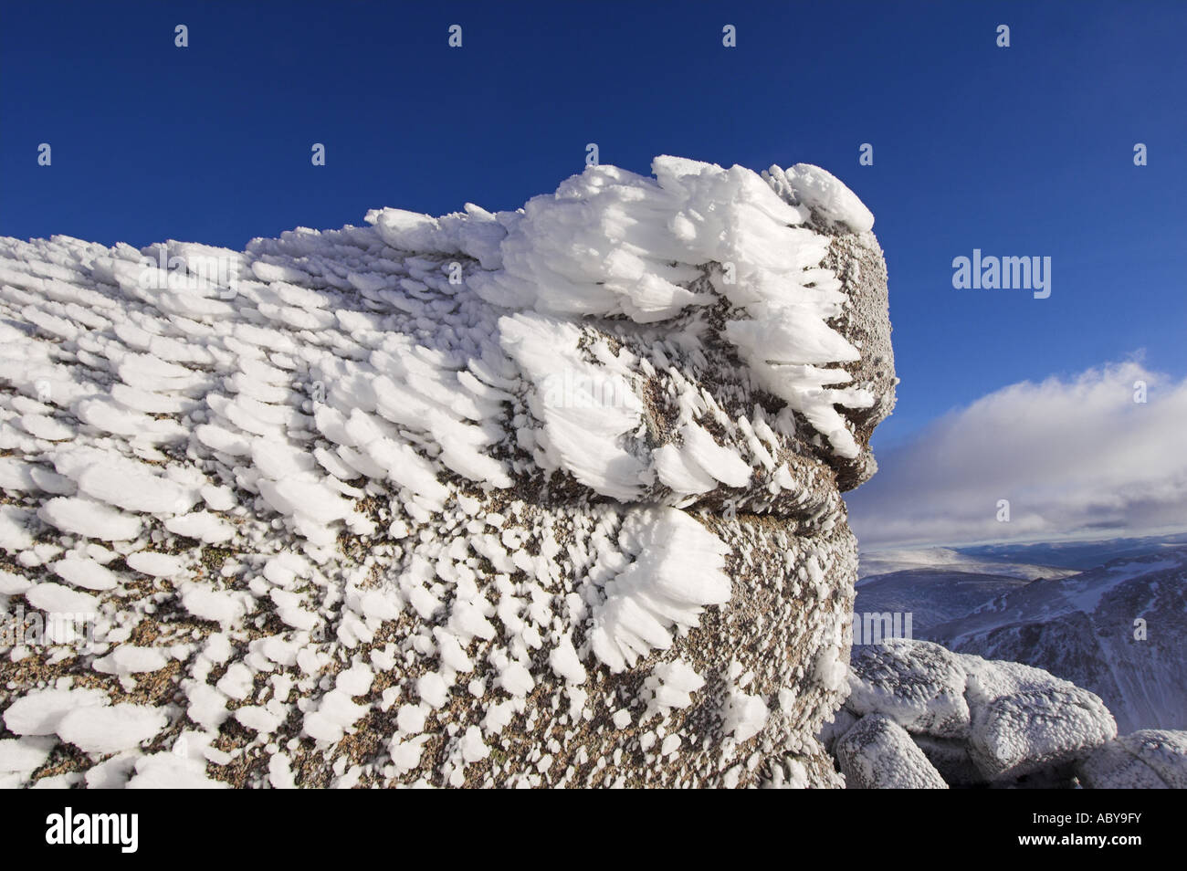 Frost feathers on weathered granite rocks on the Cairngorm plateau ...