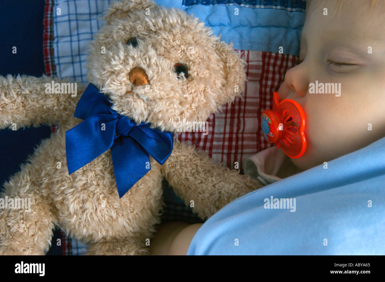 baby sleeping with teddy bear Stock Photo - Alamy