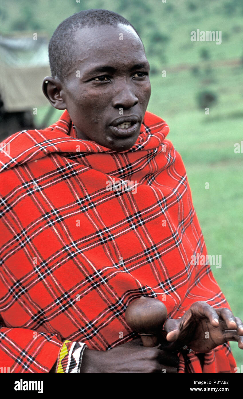 KENYA Masai Mara National Reserve Masai warrior in traditional red ...