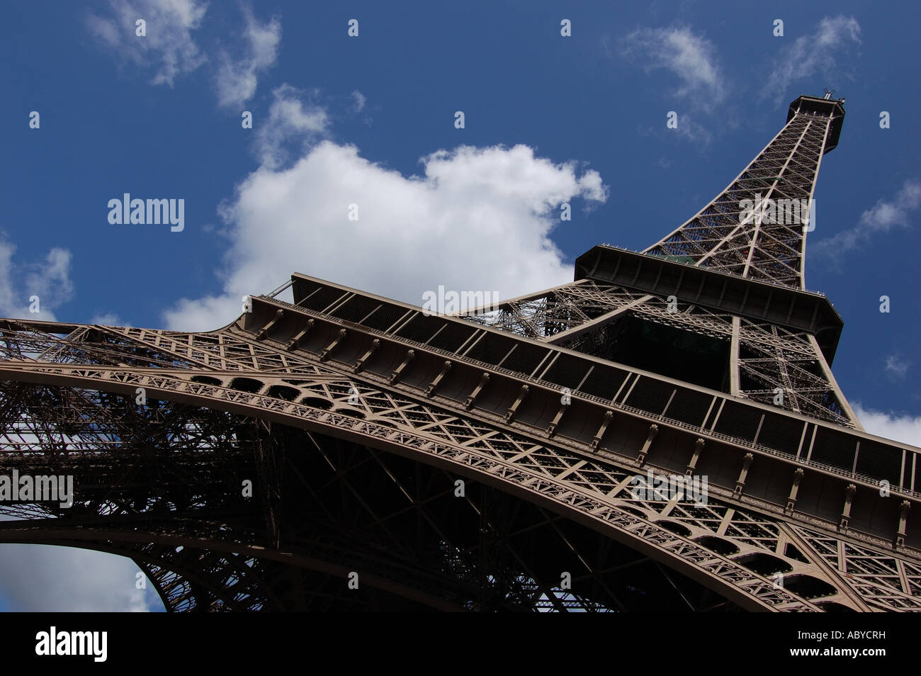 The Eiffel Tower, Paris, France, against a blue sky- horizontal ...