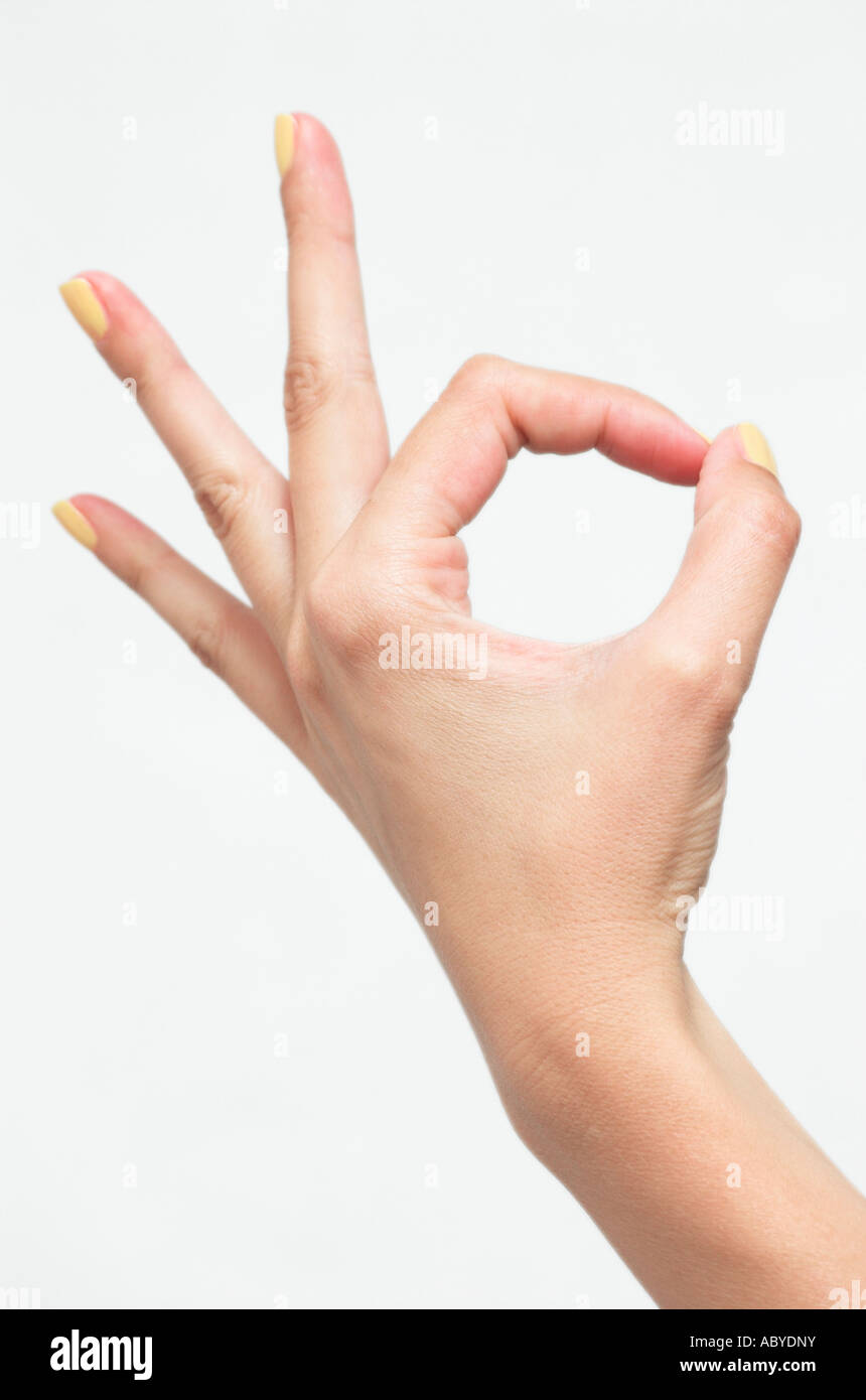 Womans hand making ok gesture Stock Photo - Alamy