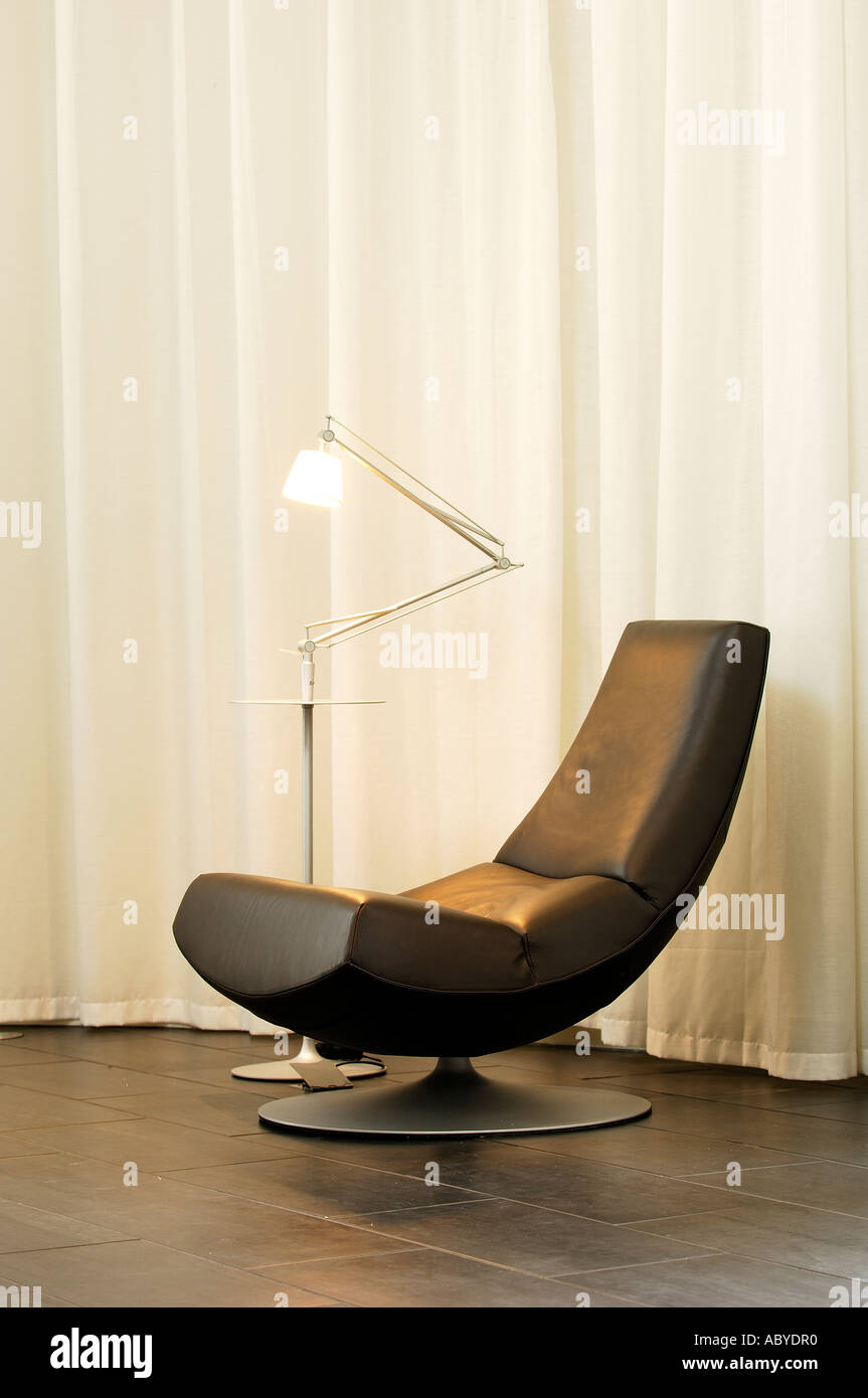 Modern Chair with reading lamp Stock Photo - Alamy