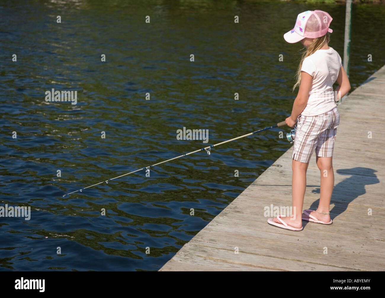 Child trying to catch a fish Stock Photo - Alamy