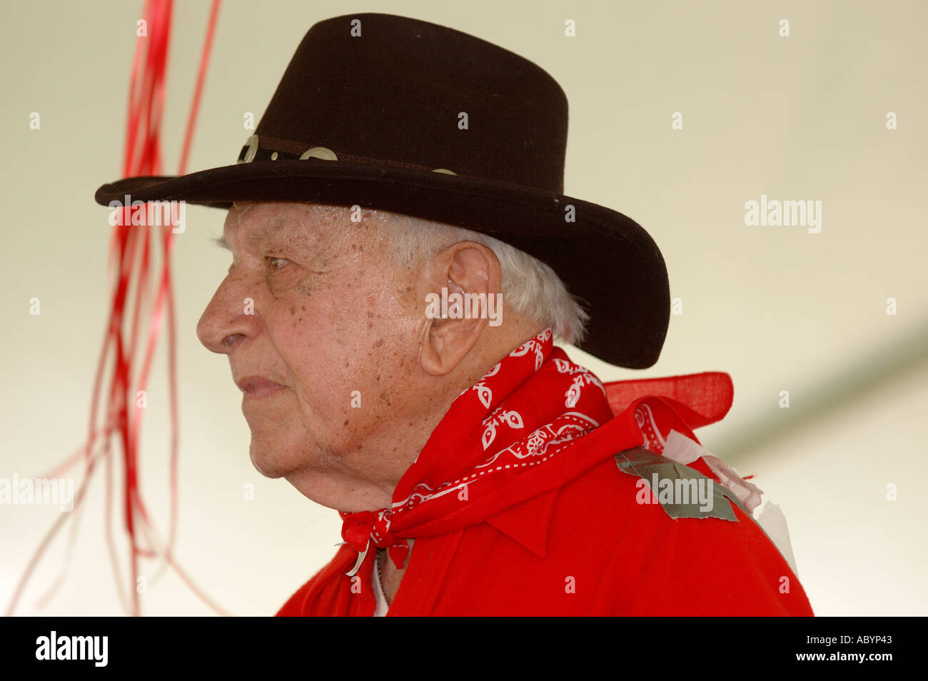 old man old aged elderly grey hair red shirt cowboy hat western hat ...