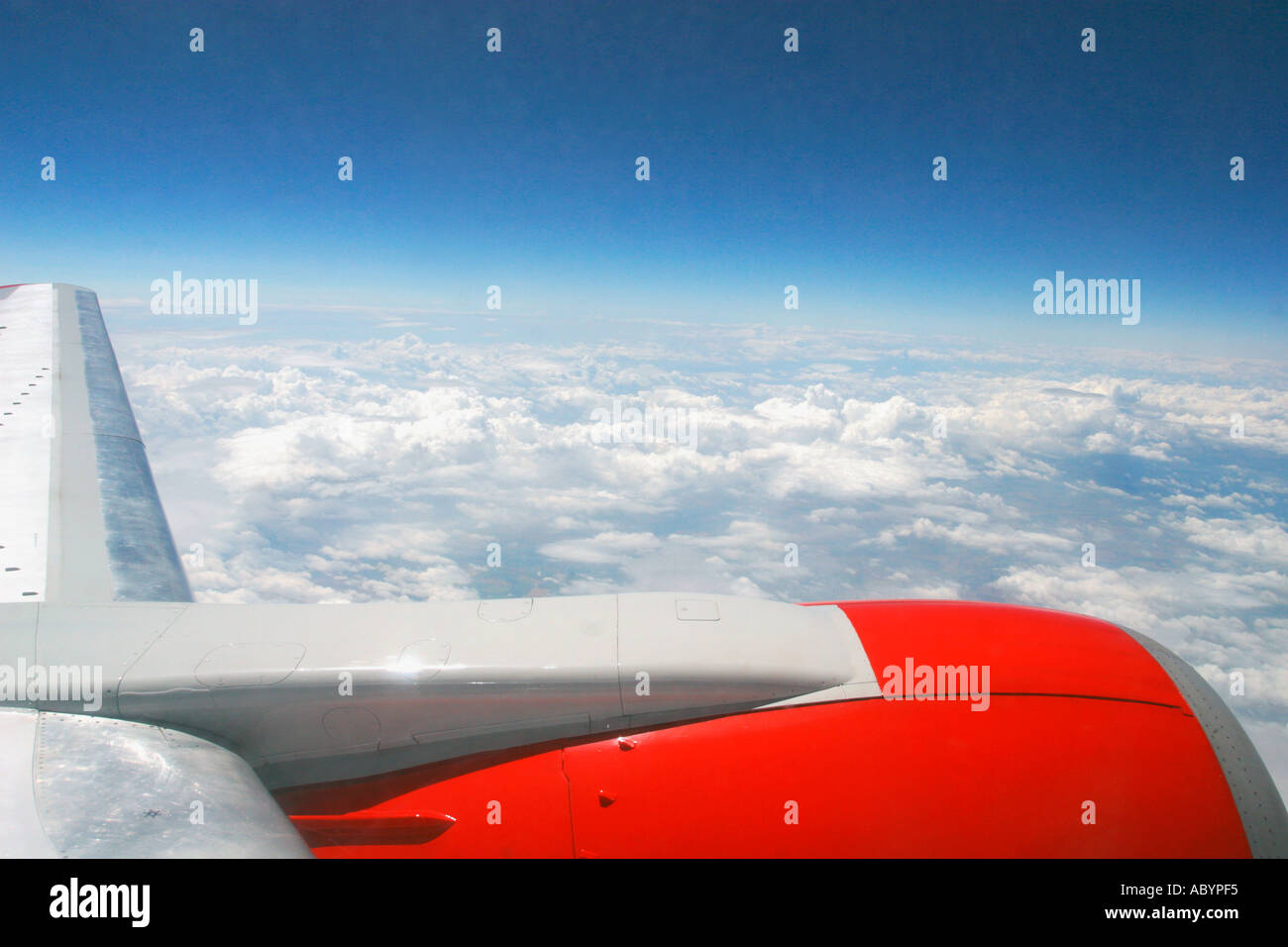Passenger jet aircraft view from window seat wing engine clouds Europe ...