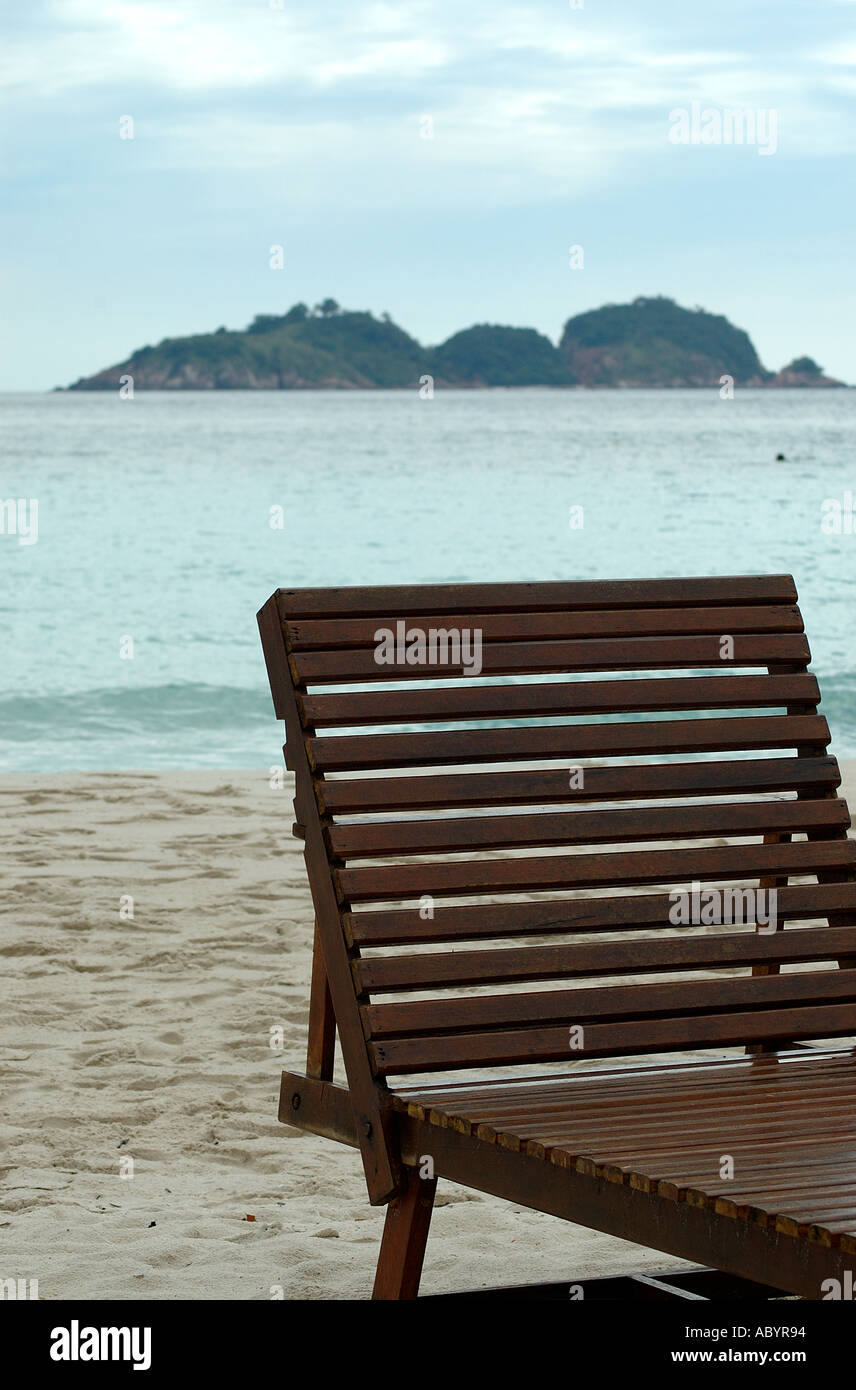Sliding wooden bench by beach Stock Photo - Alamy