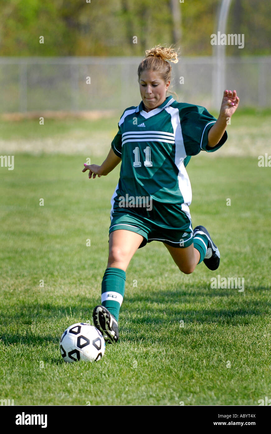 Girl Soccer Player Kicking Ball