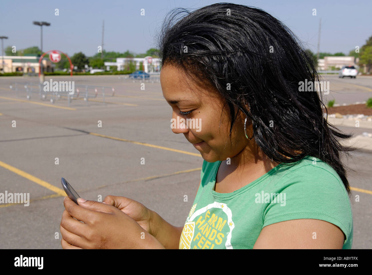 Teen female talking on a cellular telephone Stock Photo - Alamy