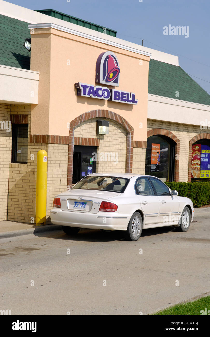 Customer in a car pickup up food from a fast food restaurant Stock ...