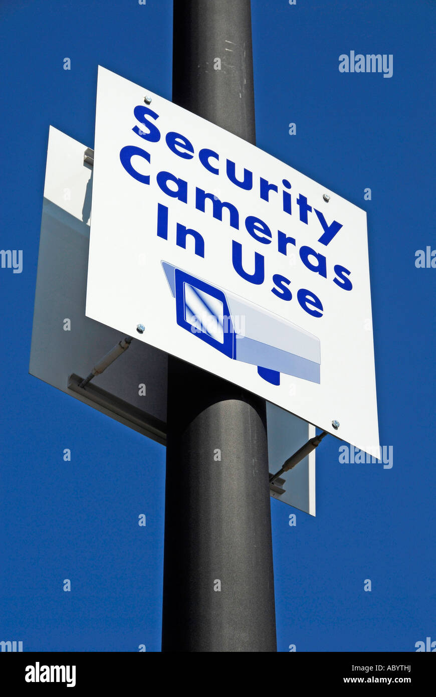 Warning sign stating security cameras are in use to protect the public ...