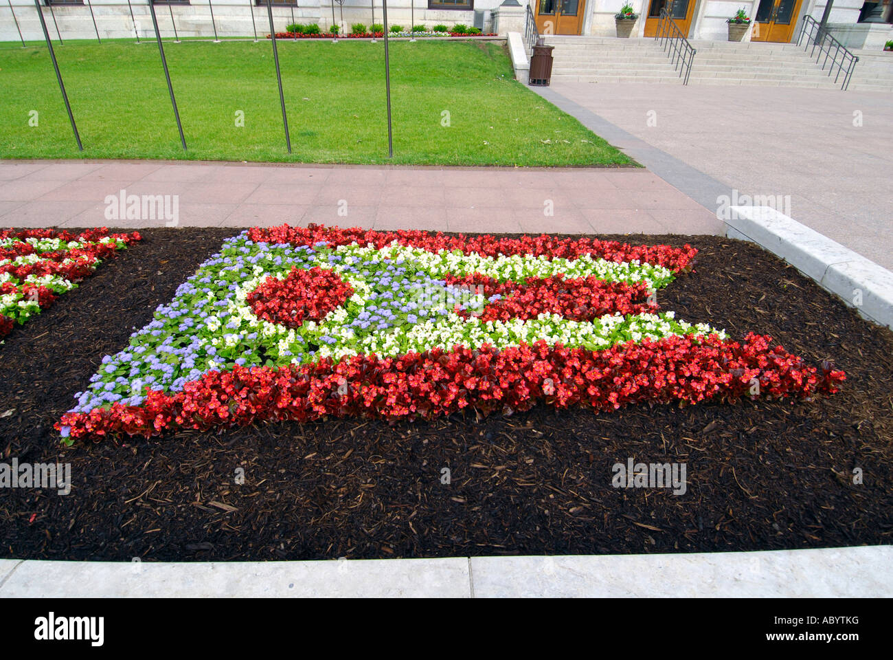State of Ohio flag made from flowers in front of the state capitol ...