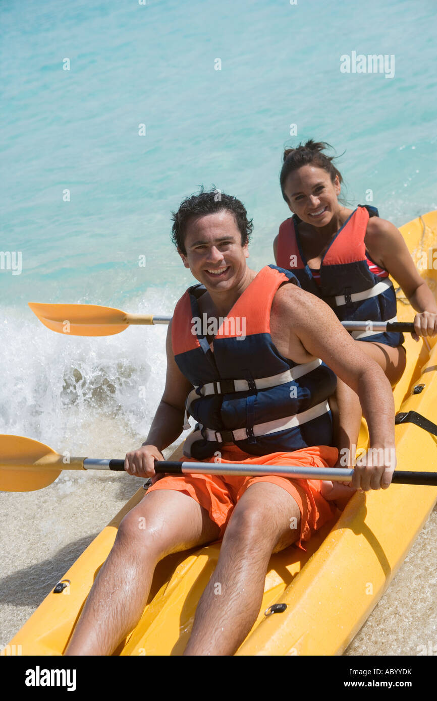 Couple kayaking in tropical waters Stock Photo - Alamy