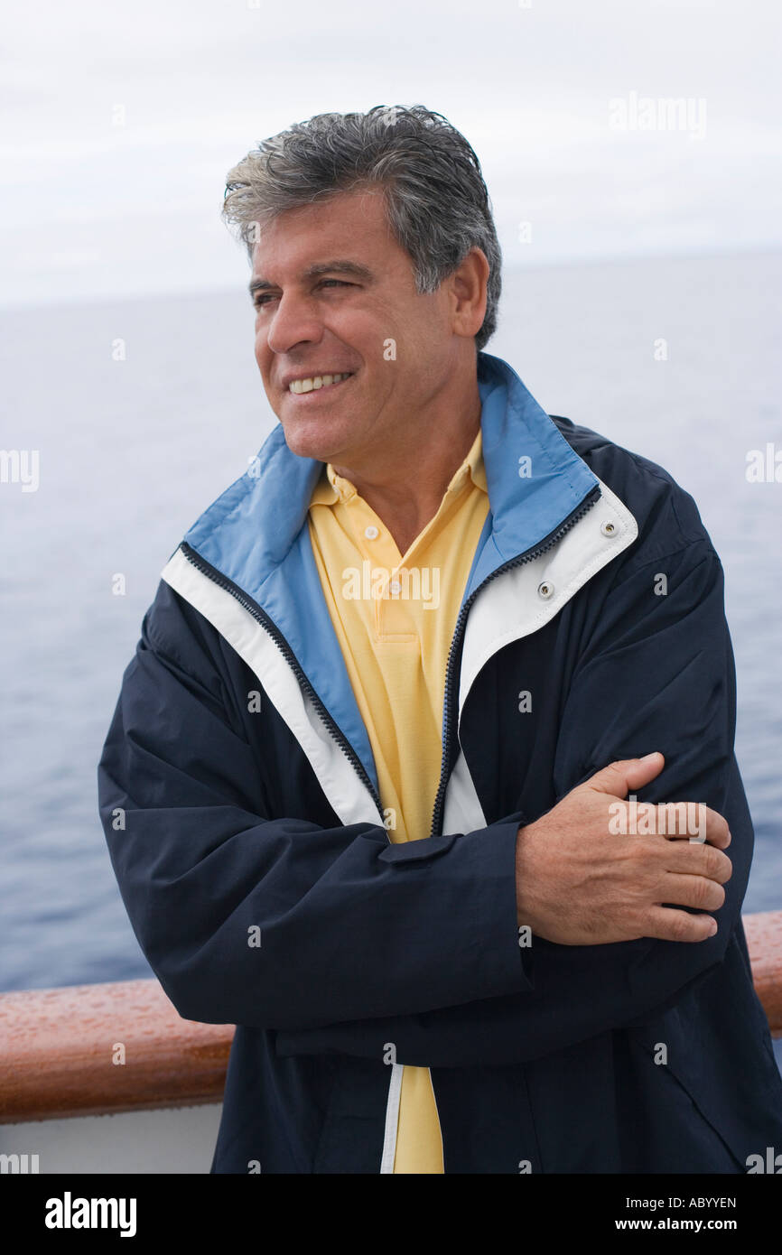 Man wearing windbreaker on ship Stock Photo - Alamy