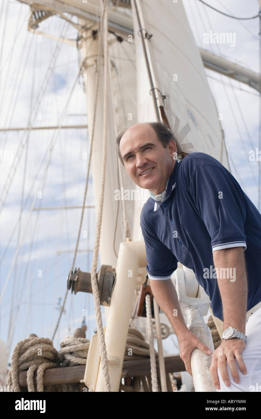 Man standing on ship deck Stock Photo - Alamy