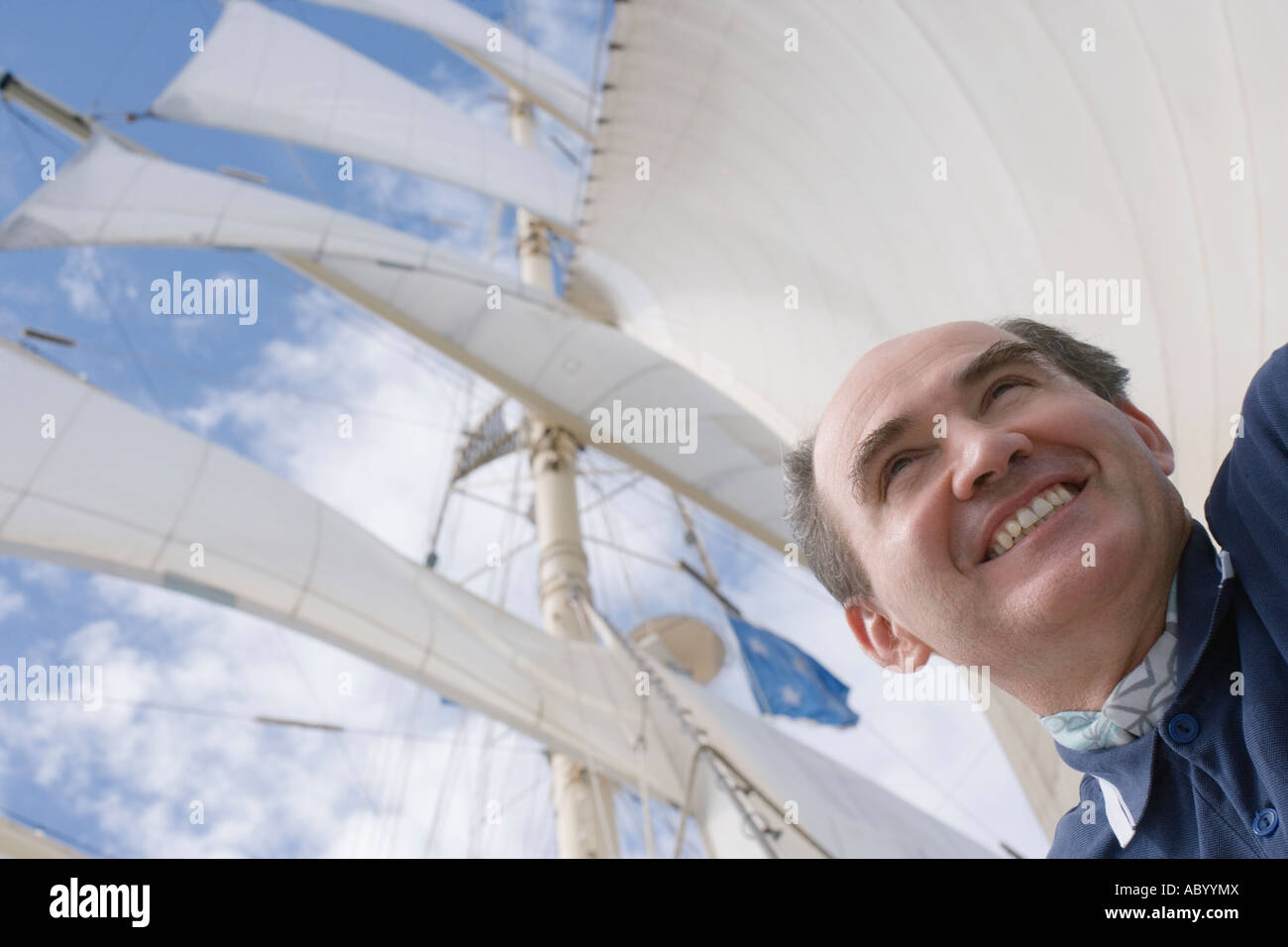 Man smiling on ship deck Stock Photo - Alamy