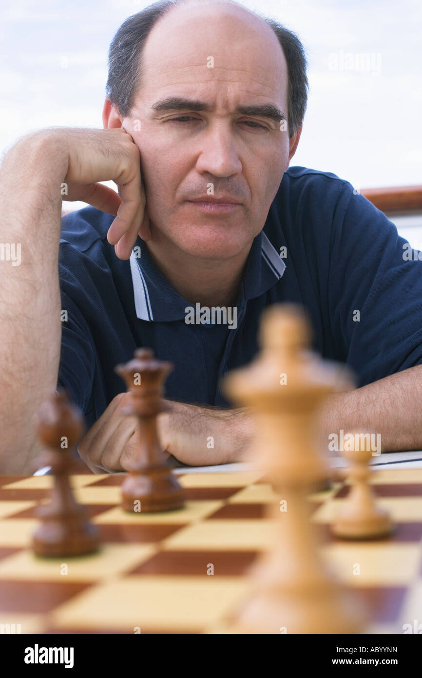 Man playing chess Stock Photo - Alamy