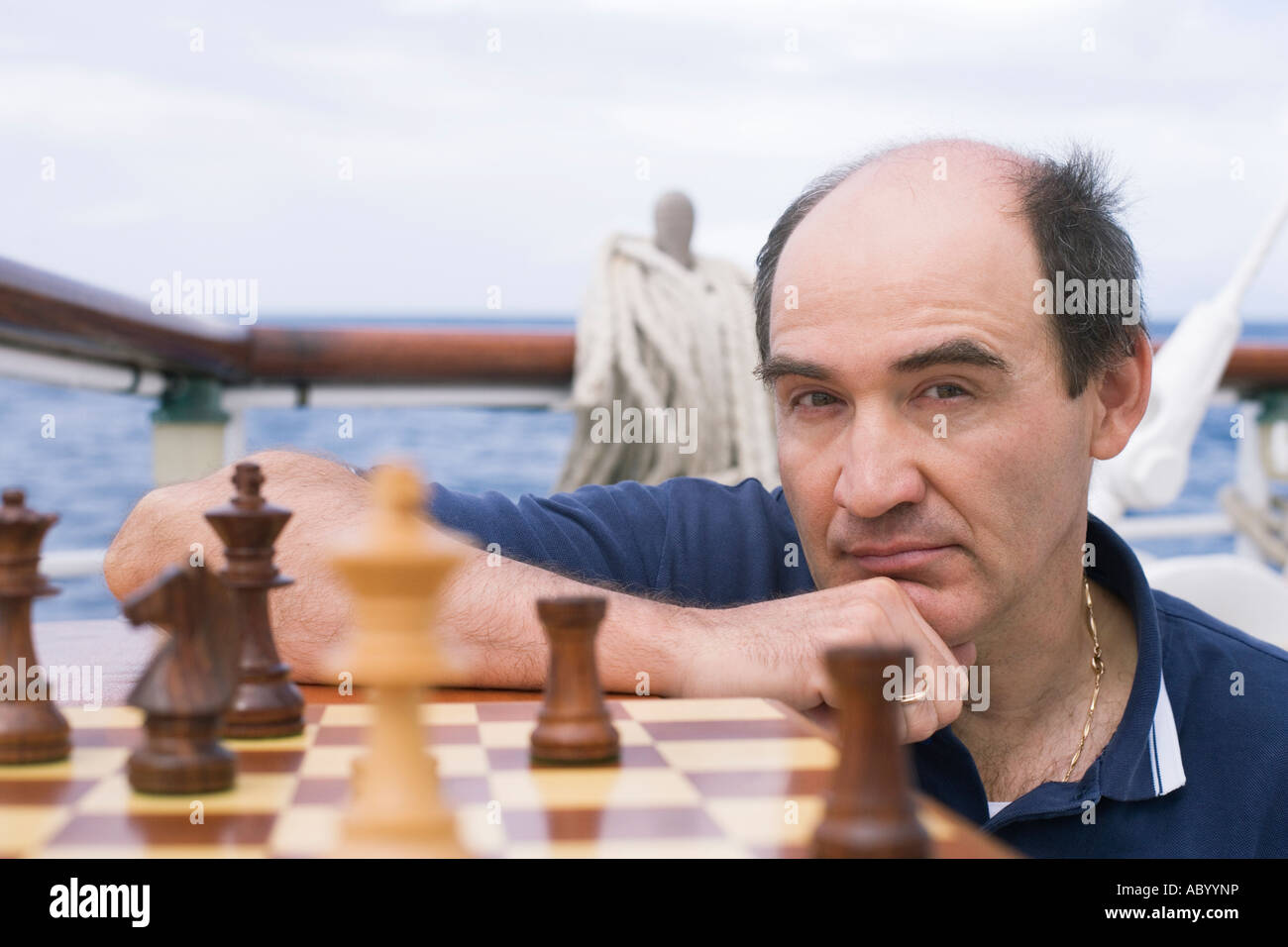 Man playing chess Stock Photo - Alamy