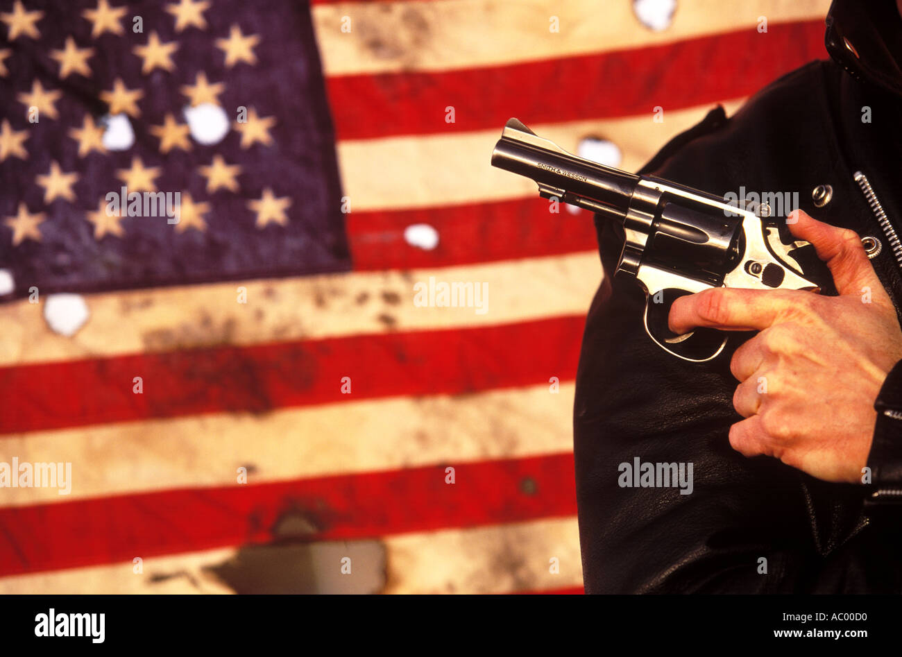 Bullet ridden American flag and gunman Stock Photo - Alamy