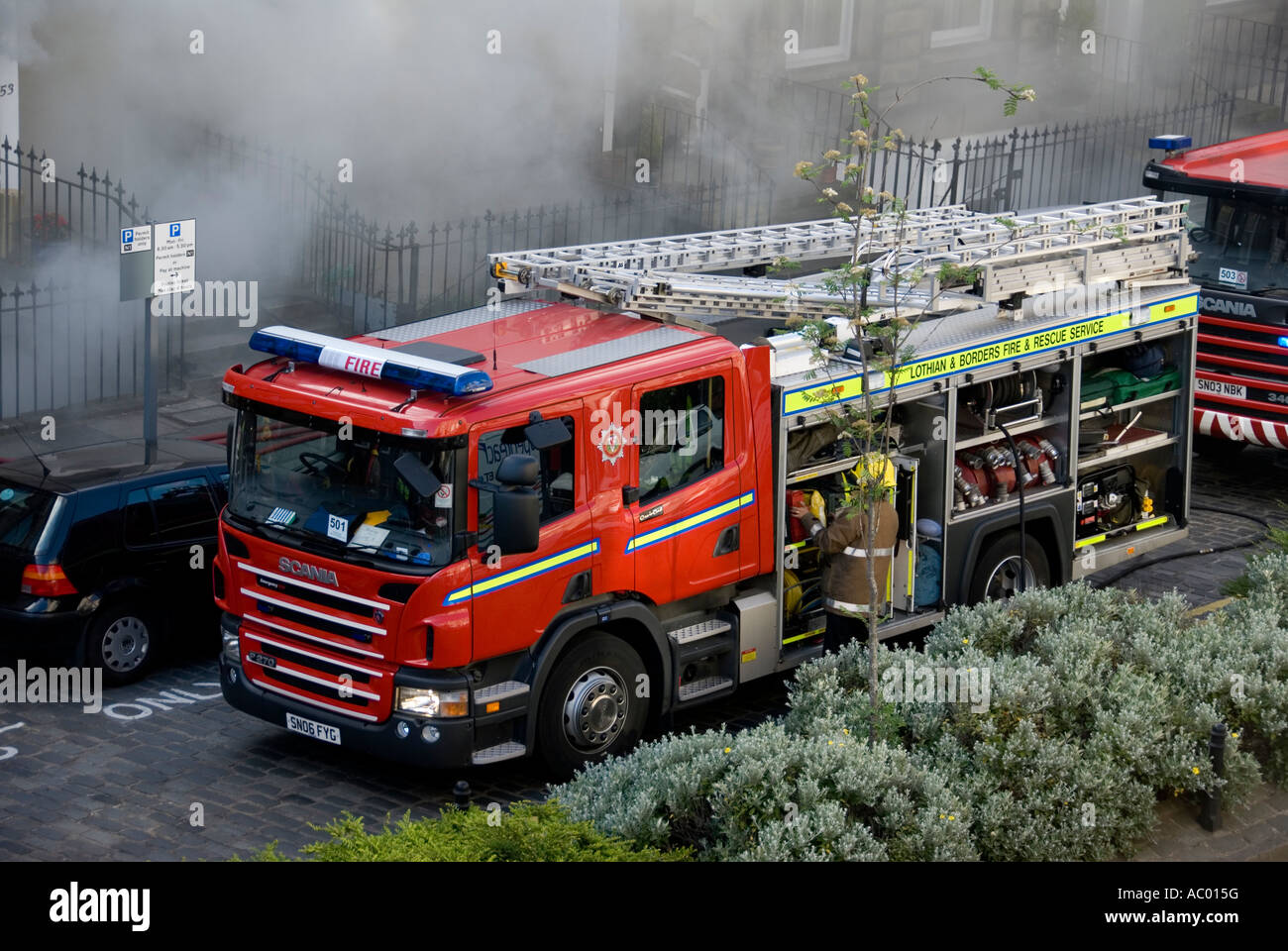Fireman in action uk hi-res stock photography and images - Alamy