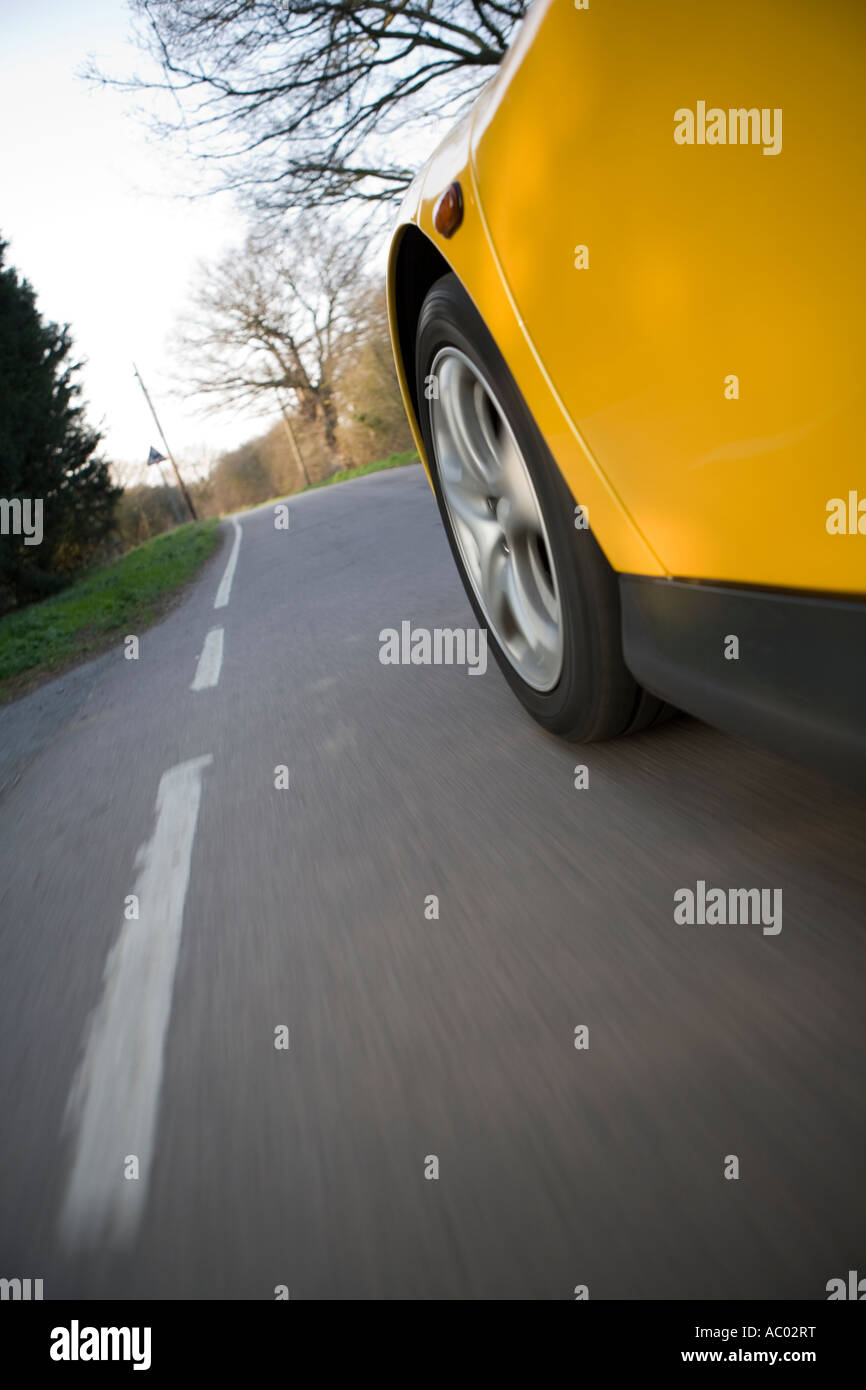 sports car going down a road Stock Photo - Alamy