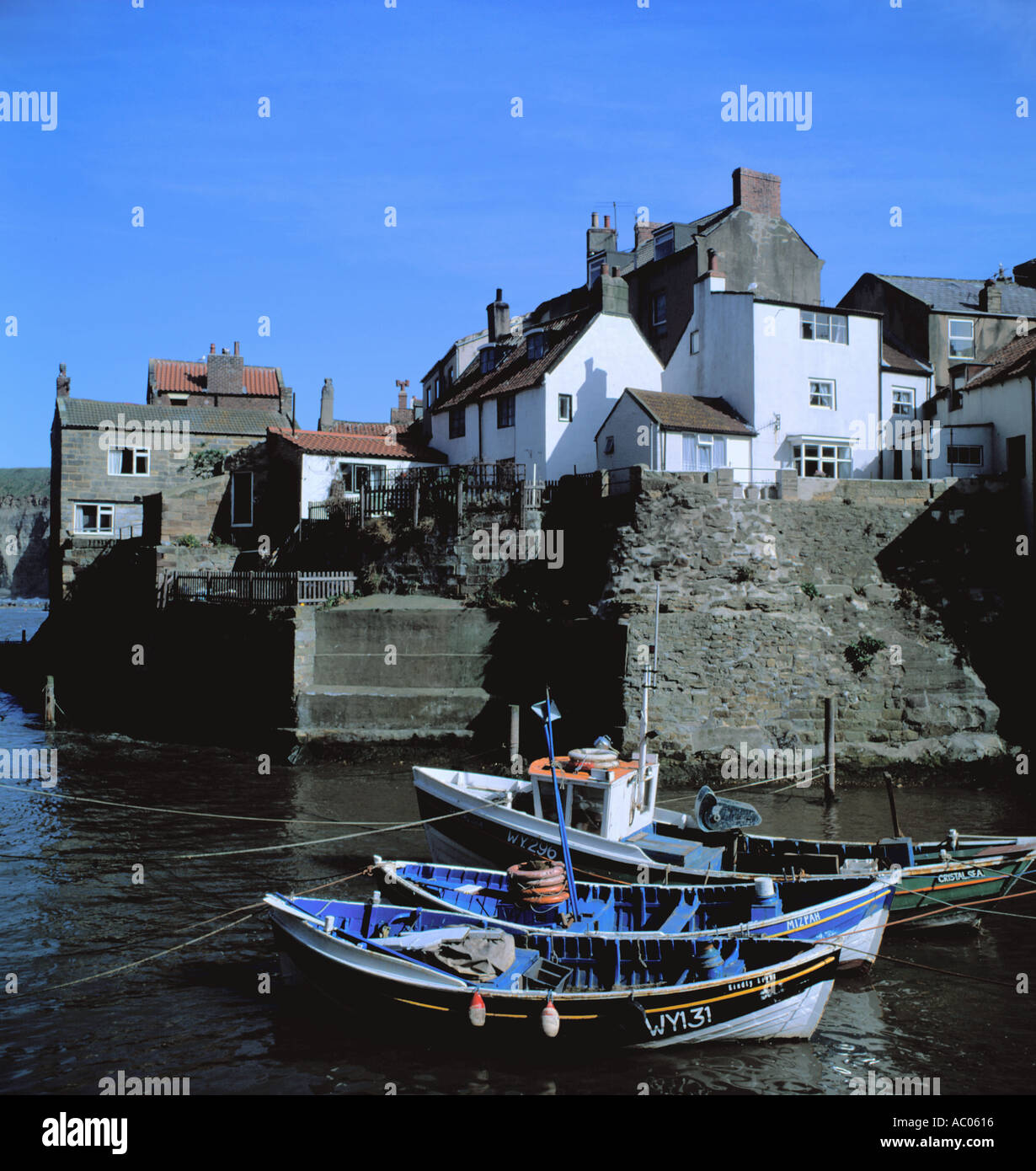 Pretty fishing boats and picturesque cottages, Staithes village, North ...