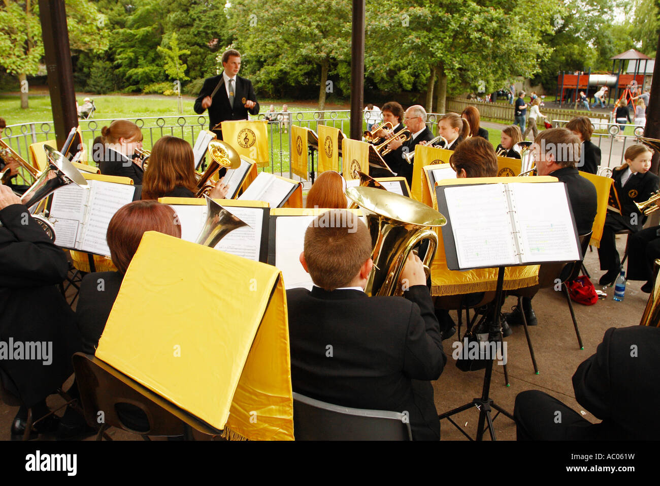 Brass band performing in public on bandstand in local park in Somerset ...