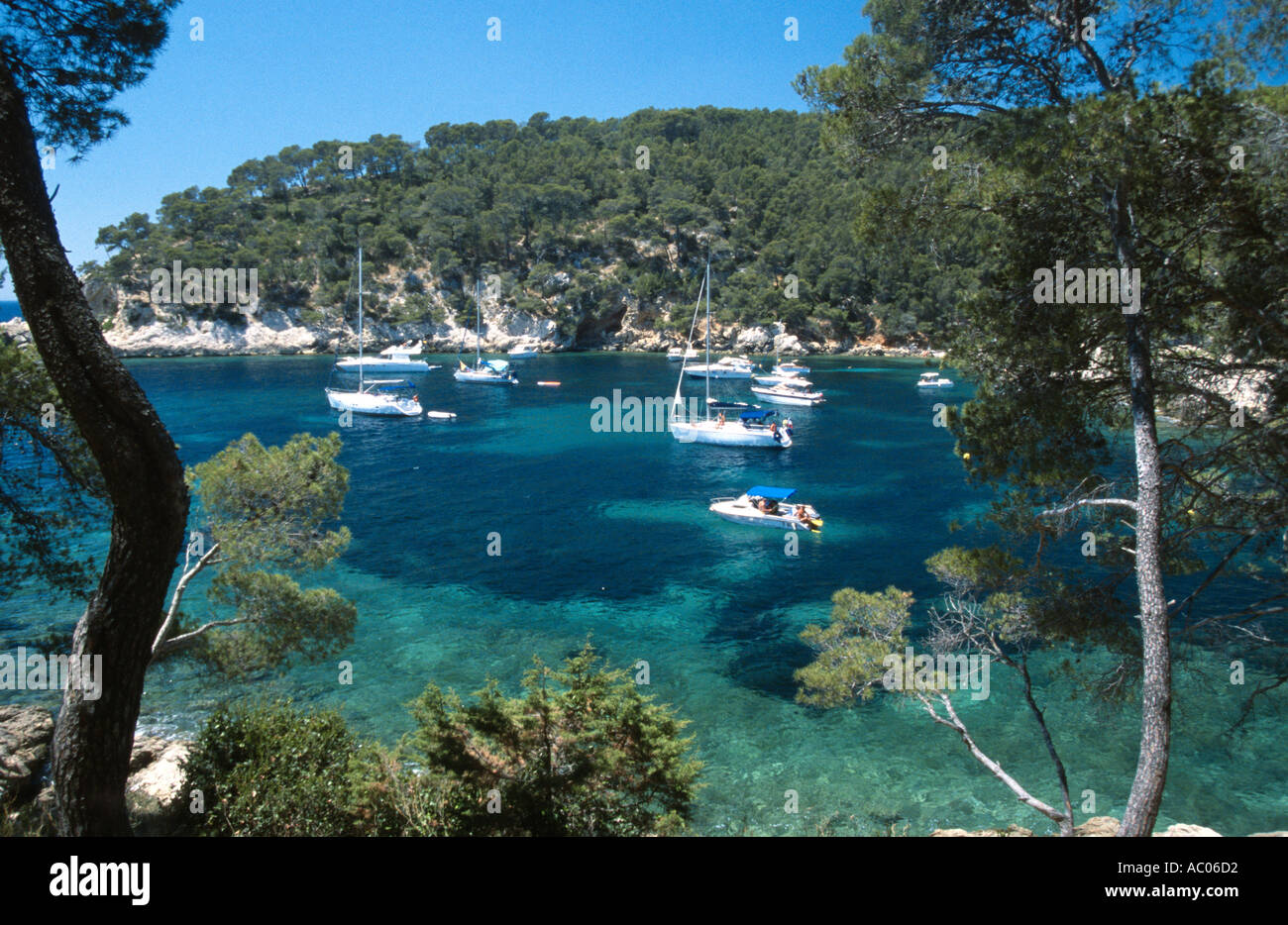 yachts moored in a beautiful Mediterranean cove inlet Port d Allon ...