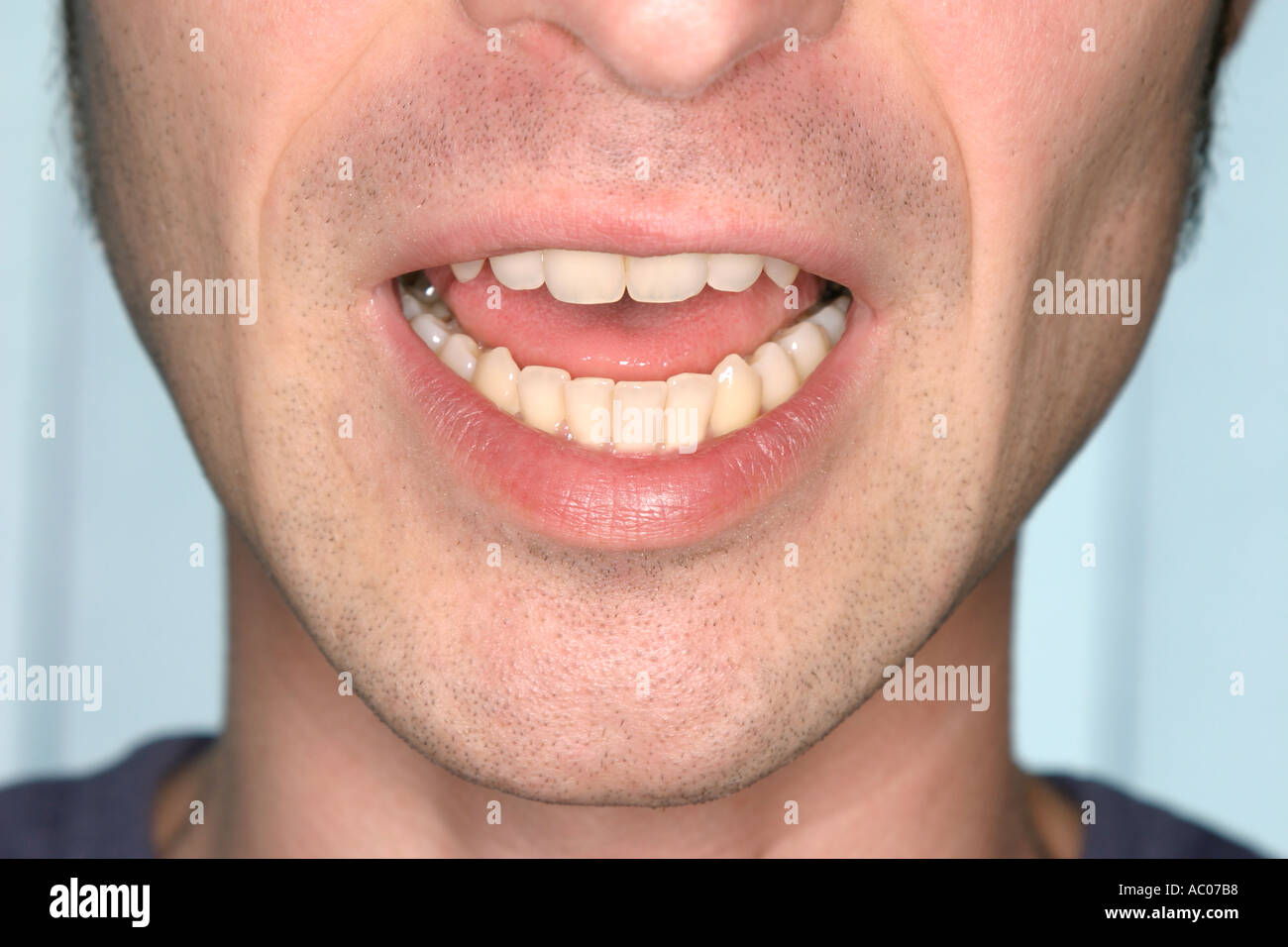mouth of young man talking shouting Stock Photo - Alamy