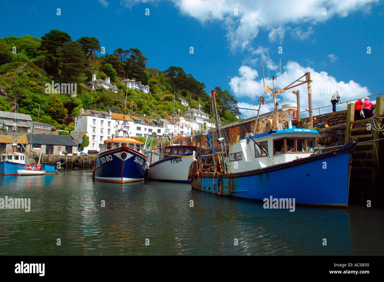 Polperro Harbour fishing boats Stock Photo - Alamy